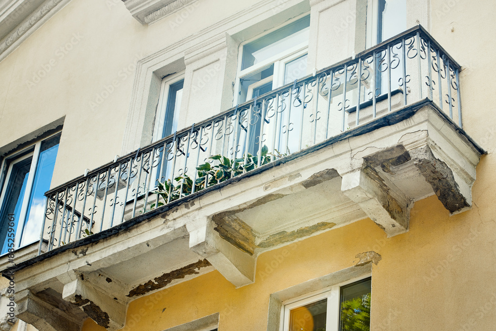 Dangerous balcony, cracks in concrete floor, risk of falling. Dangerous ...