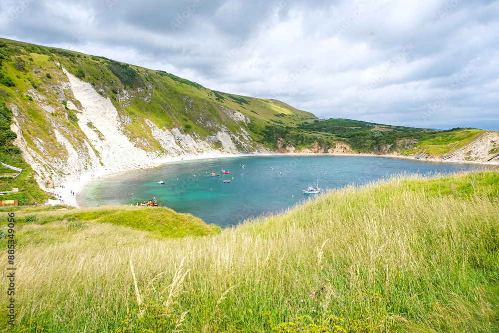 Lulworth Cove bay, beach and cliffs view . The Jurassic Coast is a ...