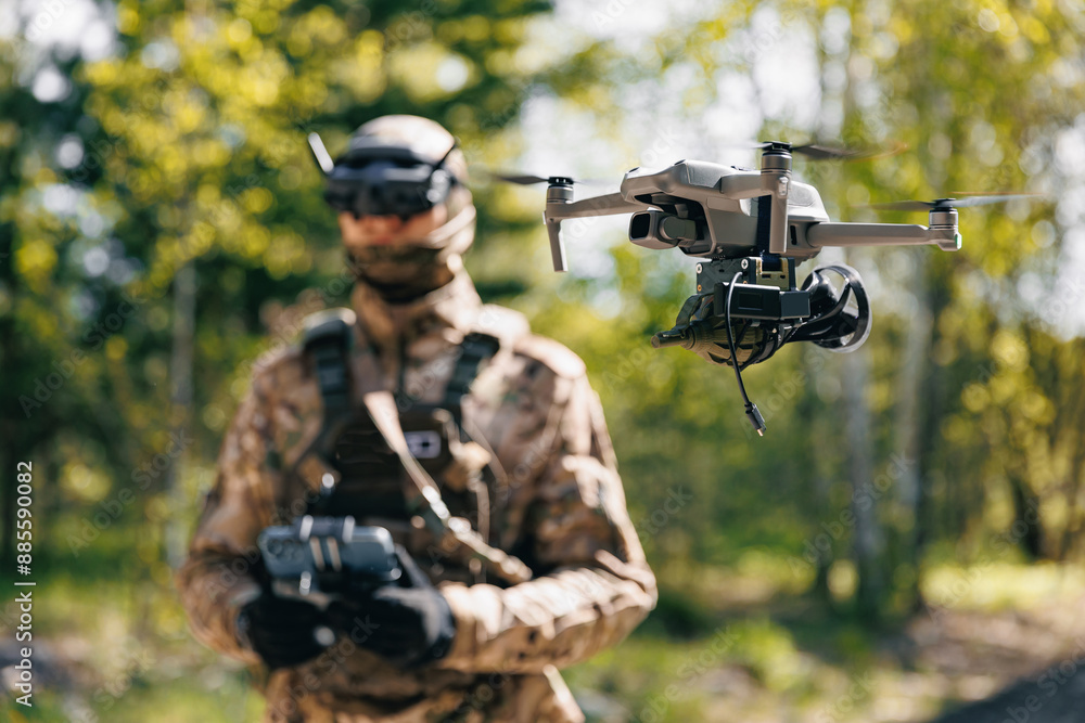 Military operator control FPV UAV drone with device for releasing bombs and grenades to enemy ...