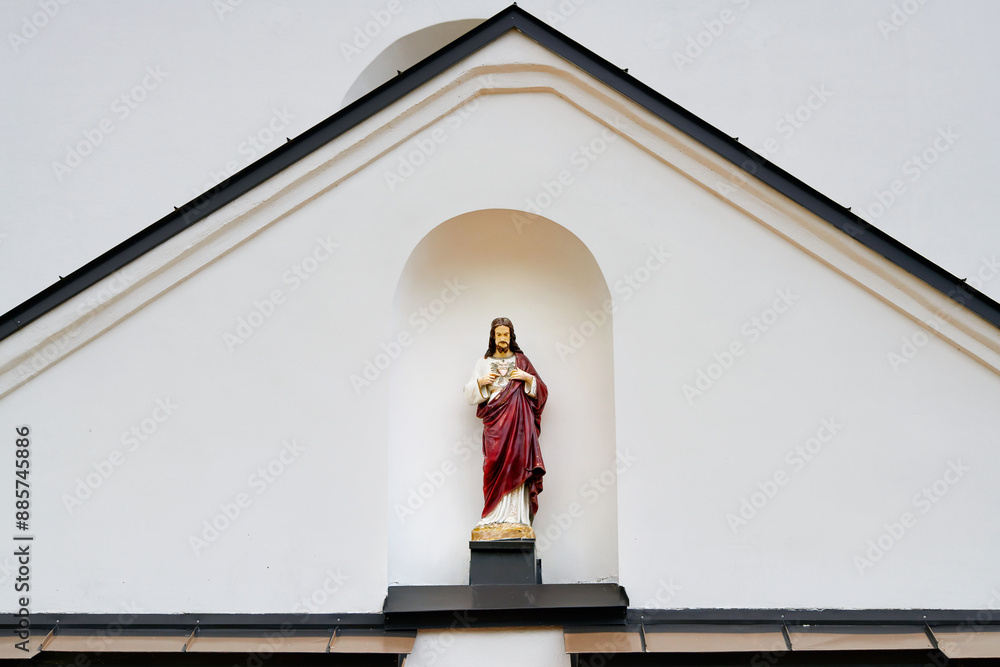 Belarus, Chernavchitsy, Jul 13, 2024. Jesus Christ statue on the niche ...