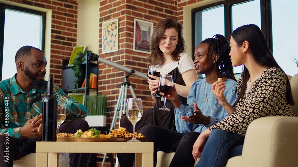 Multiracial group of people talking, drinking alcohol beverages at ...