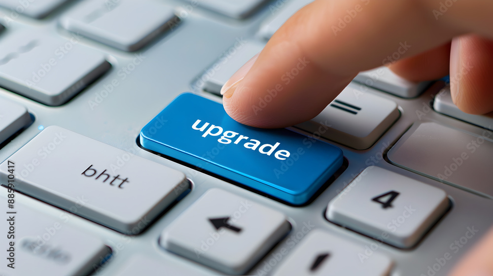Finger Pressing an Upgrade Key on a Keyboard Representing Advancements ...
