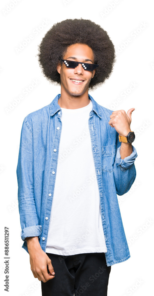 Young african american man with afro hair wearing thug life glasses ...