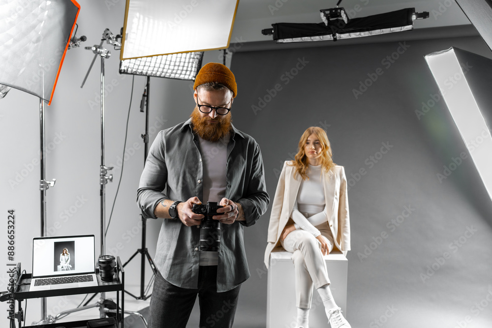 Professional photo shoot setup with photographer and model for artistic ...
