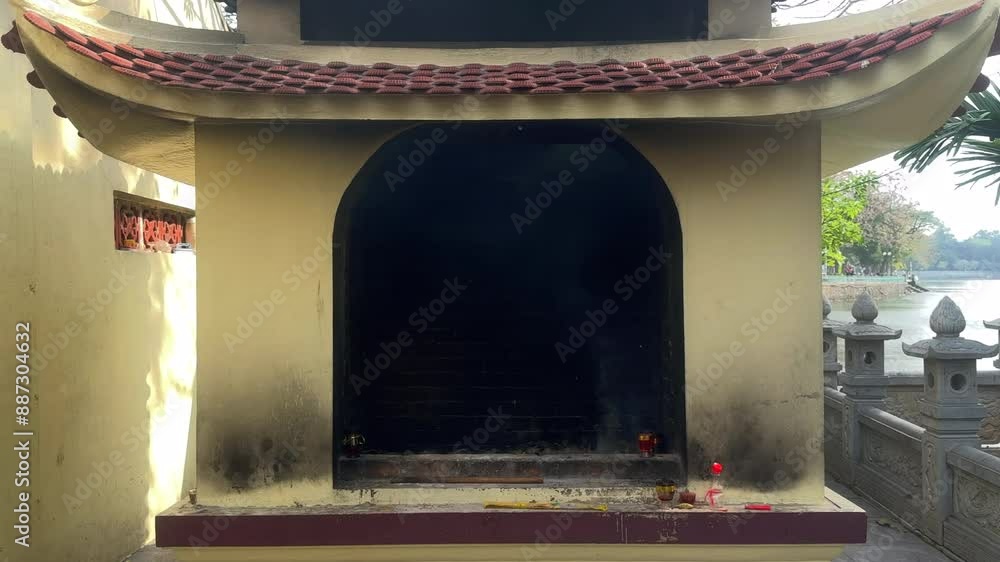 Detailed view of an incinerator at a Buddhist temple. Fire shrine at a ...
