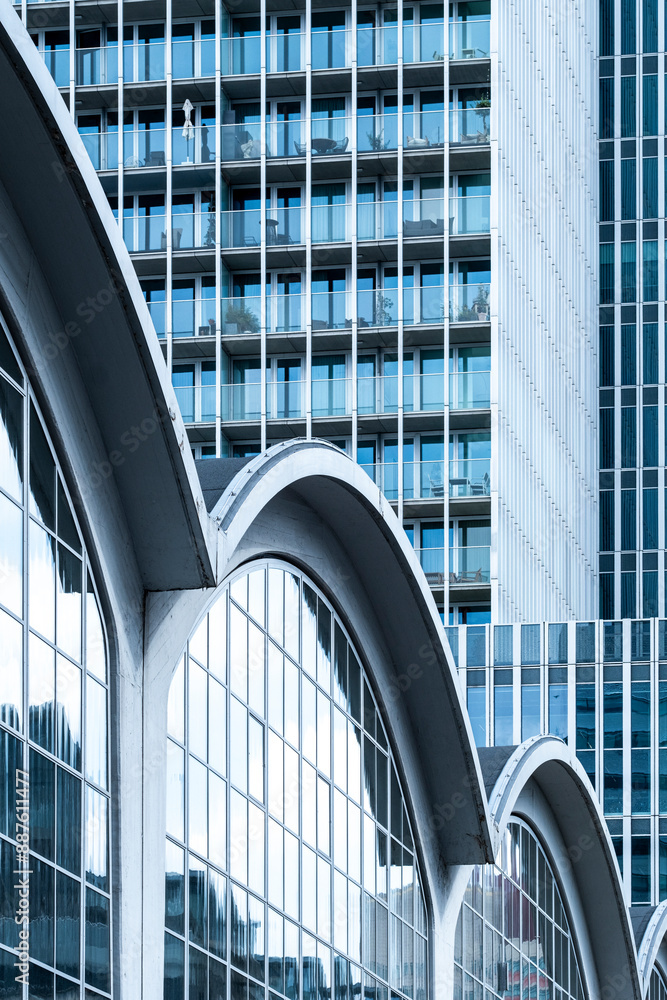 This image features glass and steel buildings with distinctive curved ...