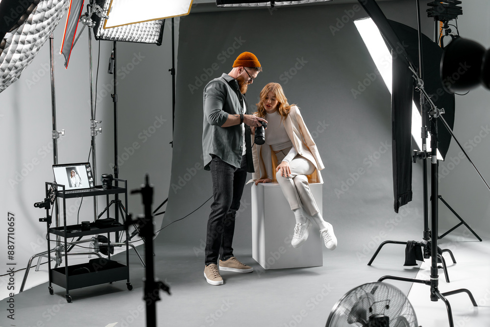 Professional Fashion Photoshoot: Photographer Adjusting Model's Pose in ...
