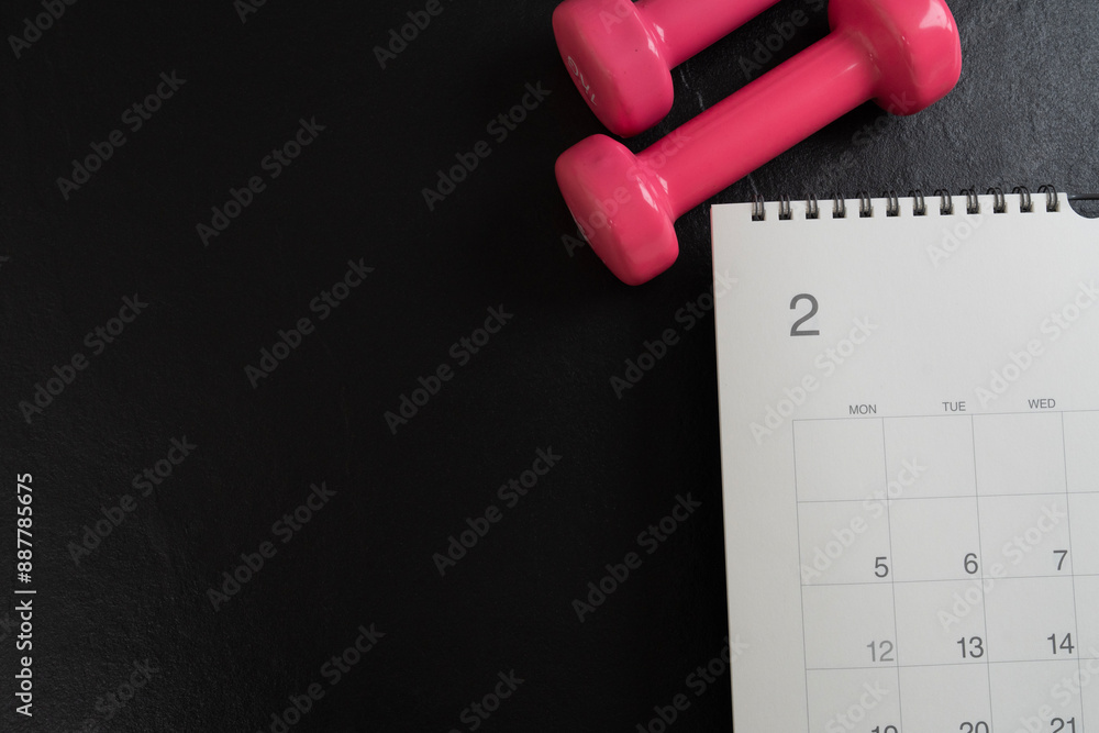 Time for exercising equipment dumbbell and calendar with black ...