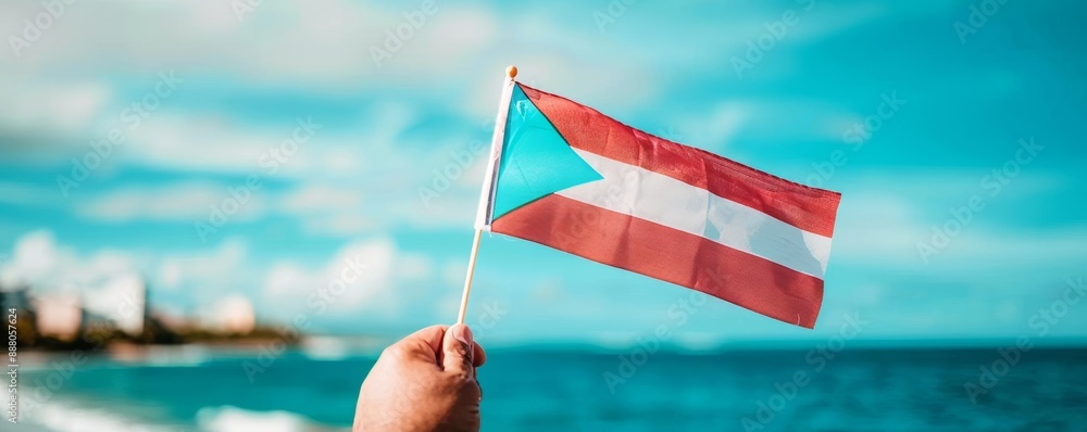 Bold and vibrant Puerto Rican flag against a blue sky, cultural ...
