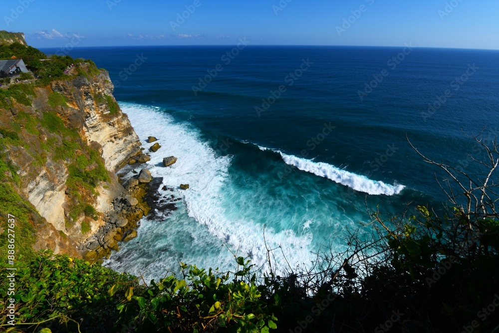 Stunning view from the edge (ulu) of a 70-meter-high cliff or rock ...