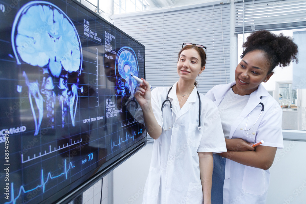 female doctor student internship team meeting and analyzing brain MRI ...