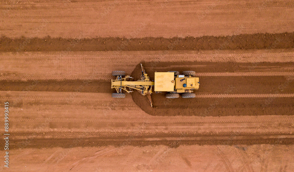 Aerial view road motor grader flatting dirt road surface, Motor grader ...