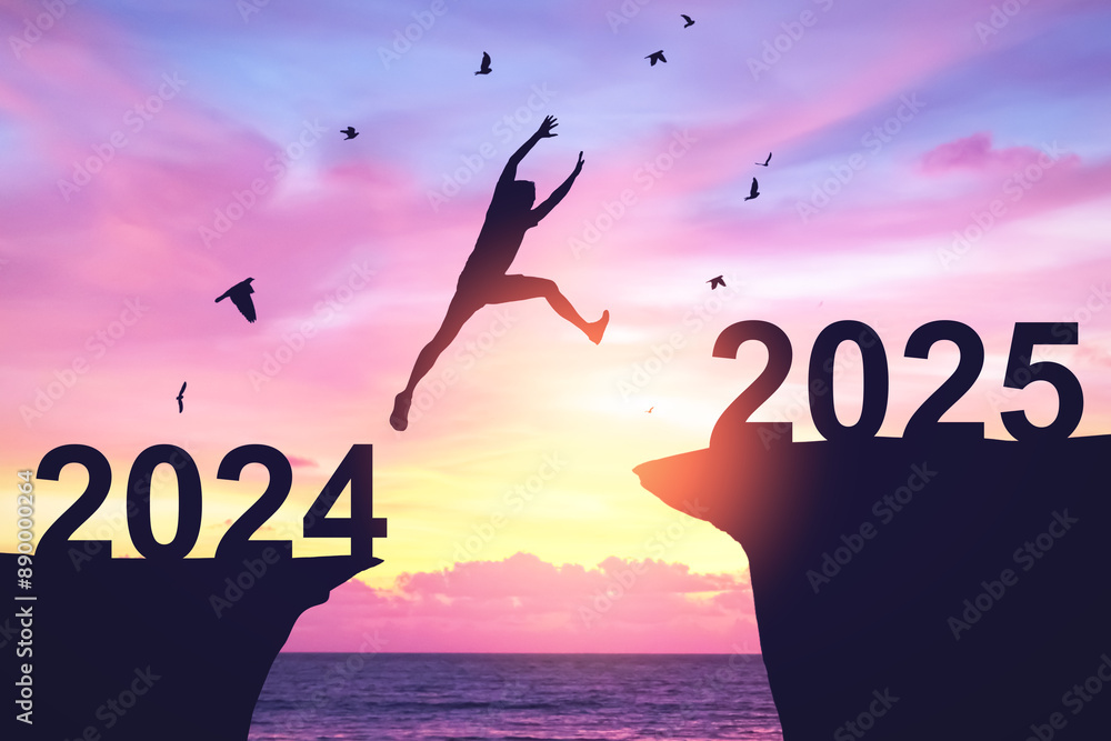 Silhouette man jumping between cliff with number 2024 to 2025 and birds ... Silhouette man jumping between cliff with number 2024 to 2025 and birds ...