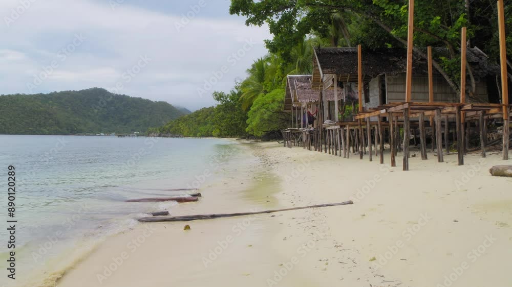 Serene view of Kri Island, Raja Ampat, Indonesia. The camera pans left ...