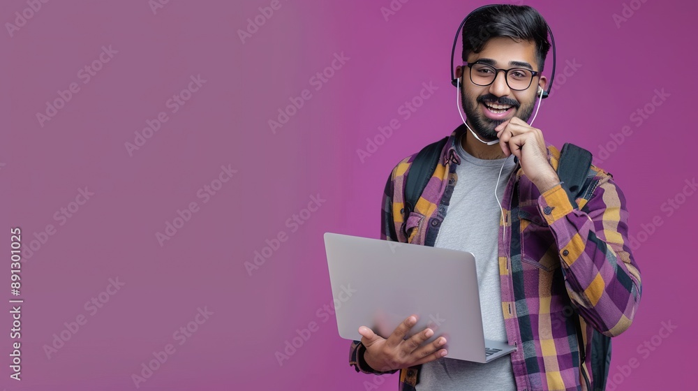 a dynamic Indian professional speaking on his Bluetooth headset ...