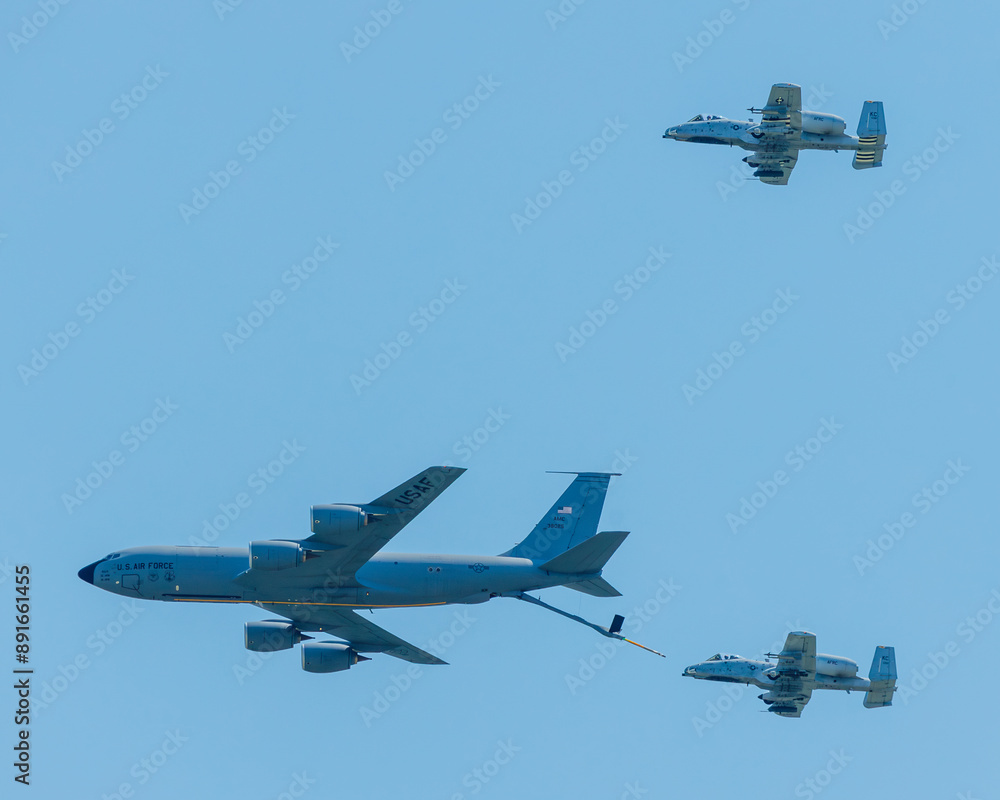 KC-135 refuelling tanker makes a close pass in formation with two A-10 ...