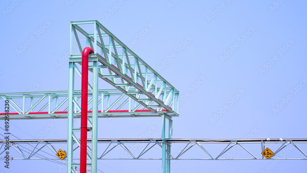 Overhead oil pipeline with metal rail and electric cable ladder tray ...