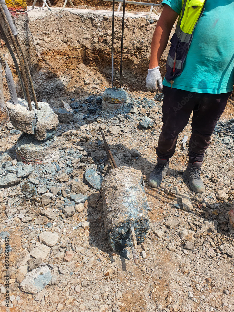 Pile foundation failure with visible corrosion and soil subsidence at ...