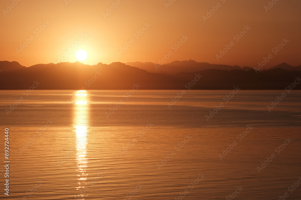 Rising sun over Saudi Arabia mountains and Gulf of Aqaba of Red Sea ...