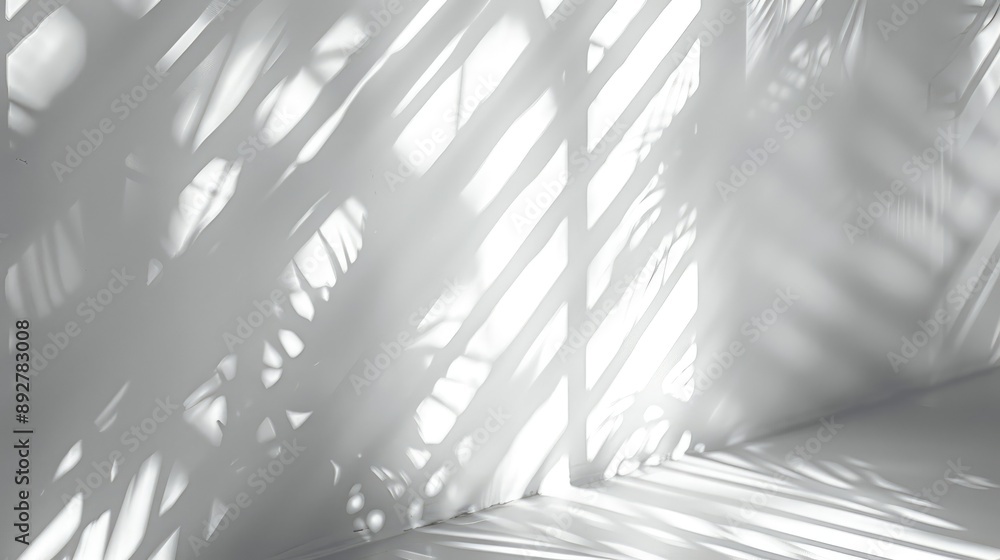 Abstract gray and light blur on white wall from window shadows; indoor ...