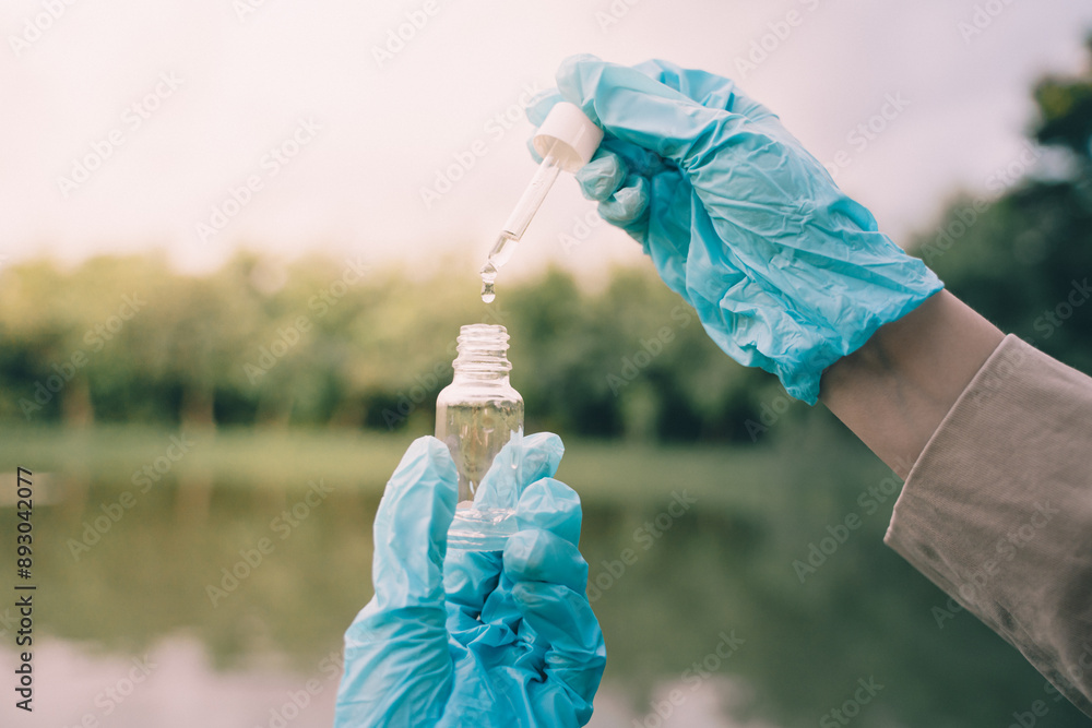The outdoor researcher used a tube to collect water from nature ...