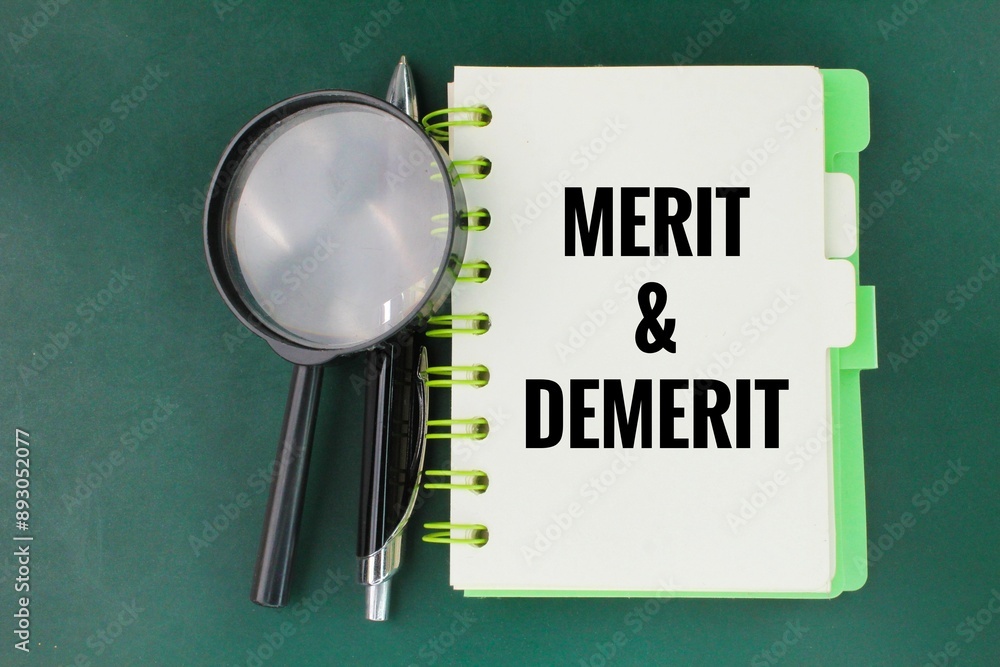 a pen, a magnifying glass and a book with the words MERIT and DEMERIT ...