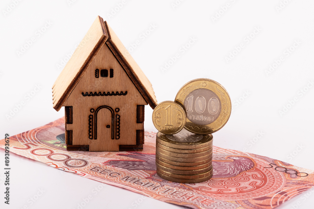 Kazakhstani ionets in denominations of 1 and 100 tenge, a model of a ...