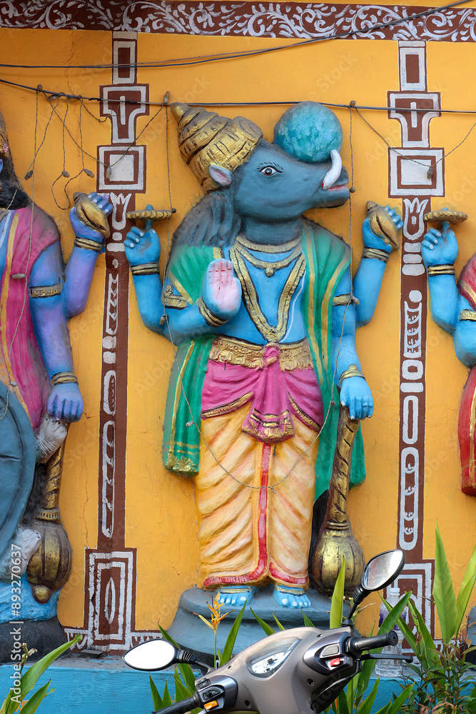 The boar god Varaha is an avatar of Vishnu. Bas-relief on the wall of a ...