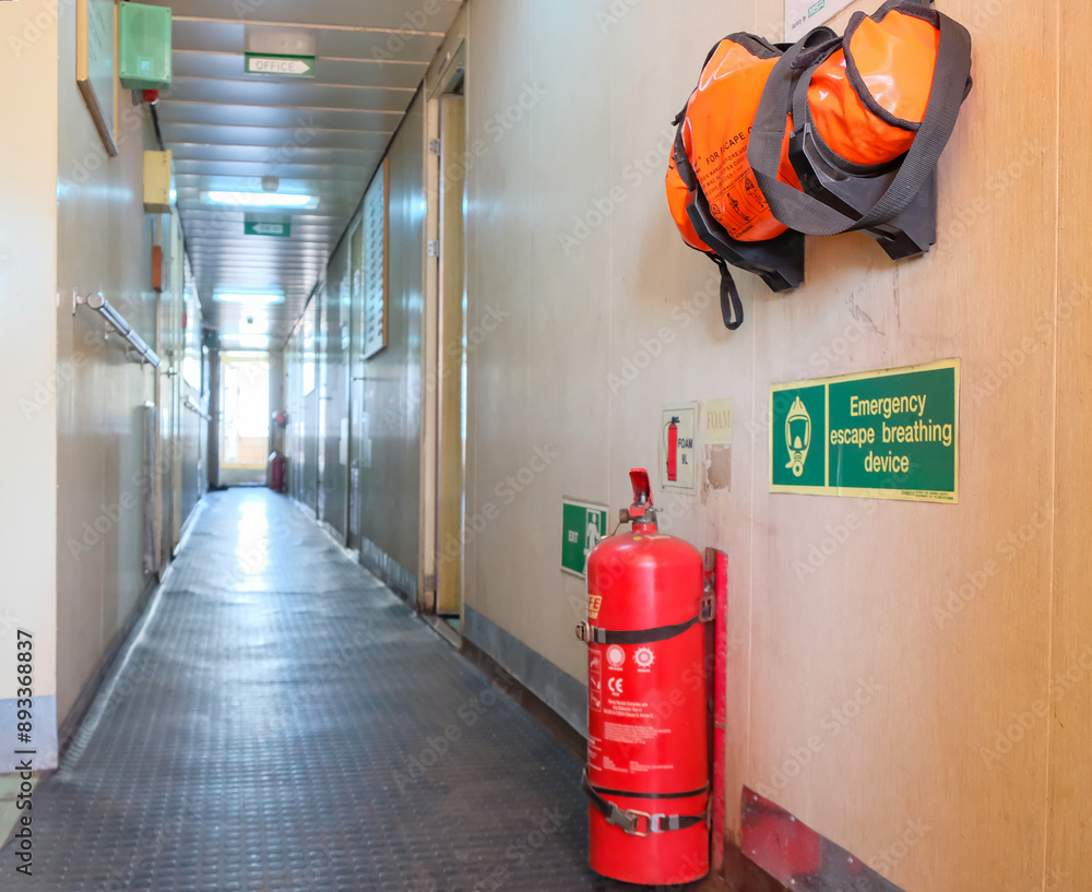 Emergency escape breathing device EEBD and fire extinguisher placed in ...