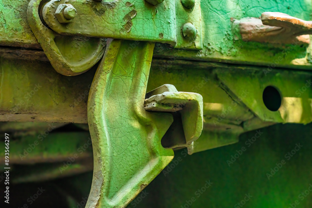 Powerful metal lock on a railway carriage. A simple green steel lock ...