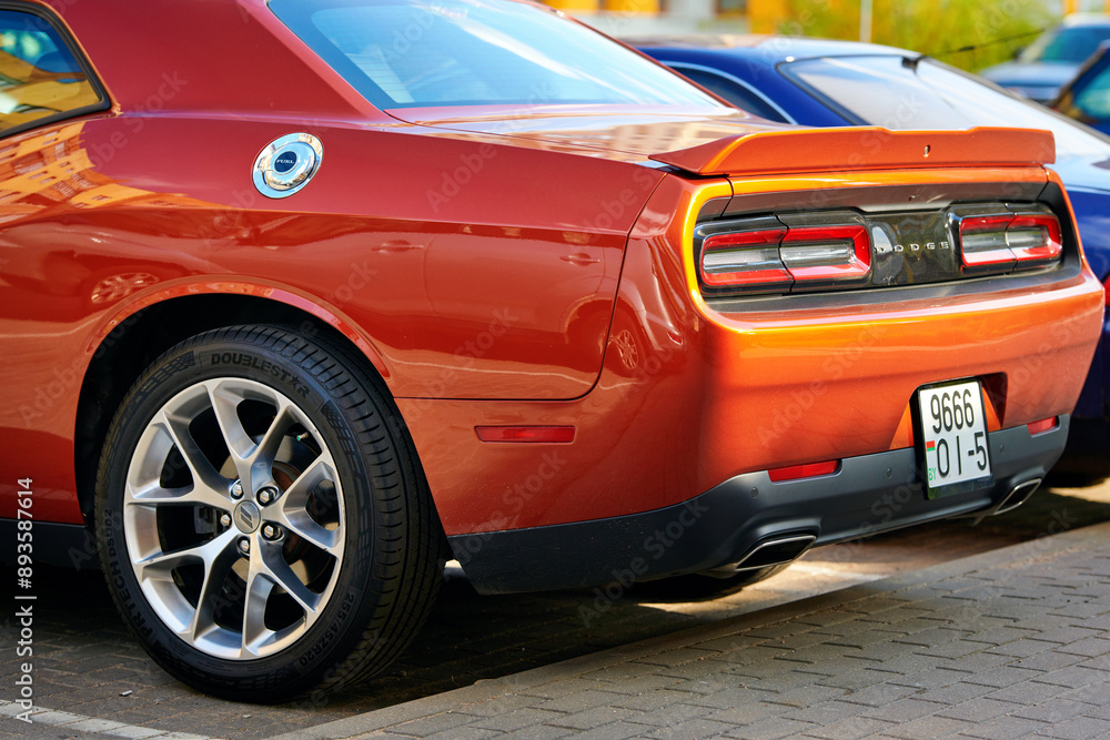 Minsk, Belarus. Apr 27, 2024. Orange Dodge Challenger from the back ...