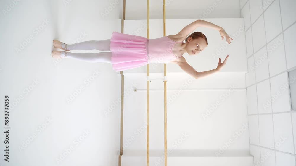 Young ballet girl at studio lesson. Training performance. Stretching ...