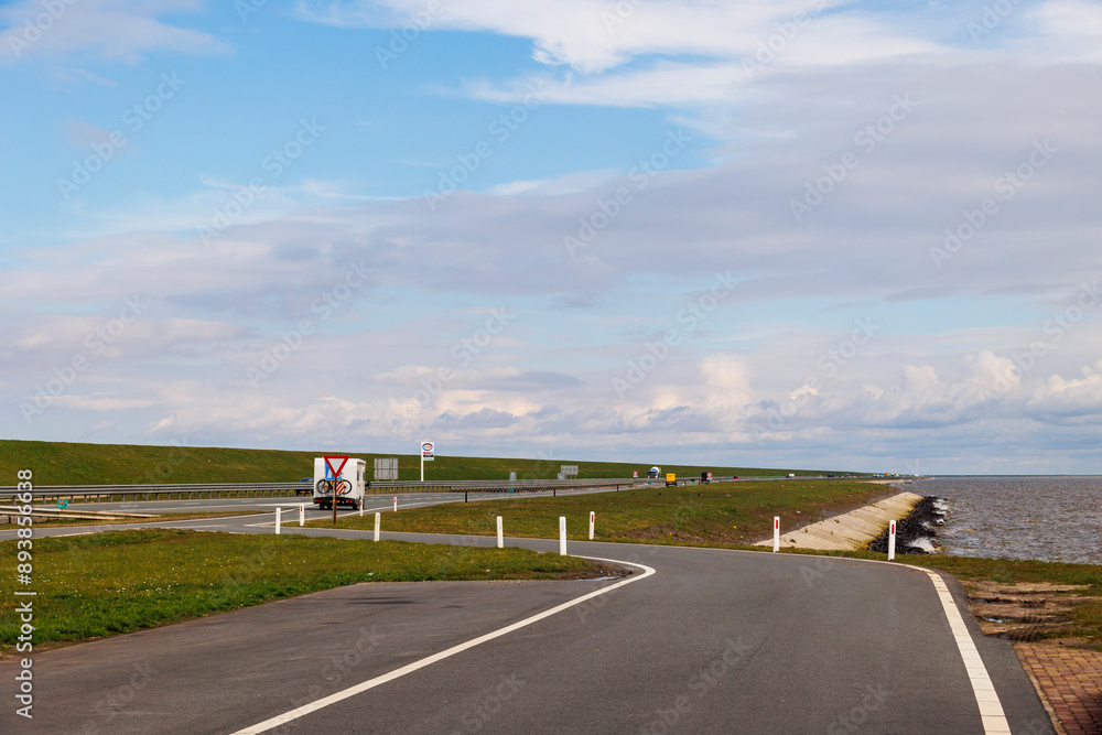 rest area on the Afsluitdijk between IJsselmeer and Wadden Sea in front ...