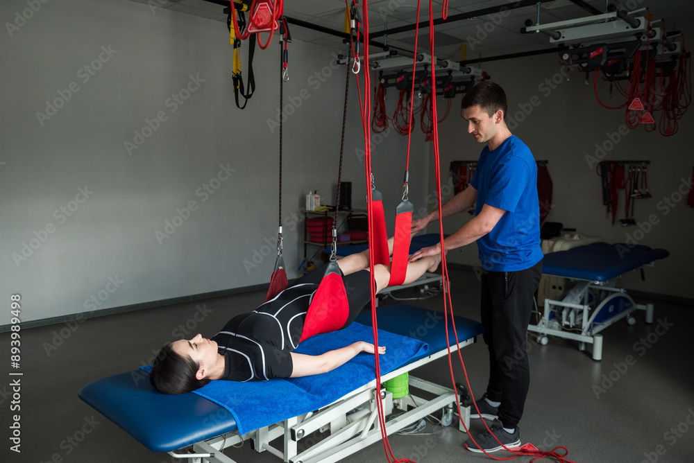 Red cord rehabilitation to recover from muscle pain. Activation of back ...