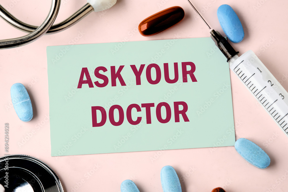 Healthcare concept. Ask your Doctor text message on the business card ...