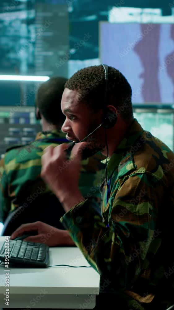 Vertical Video Soldiers in a state of the art military control room ...