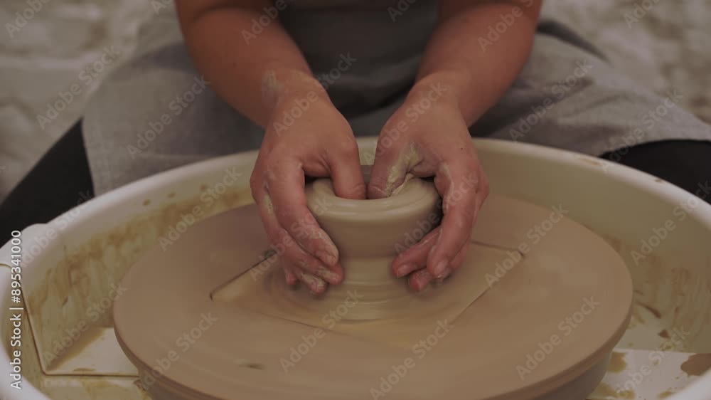 Learning how to model clay into different shapes with pottery wheel 4k ...