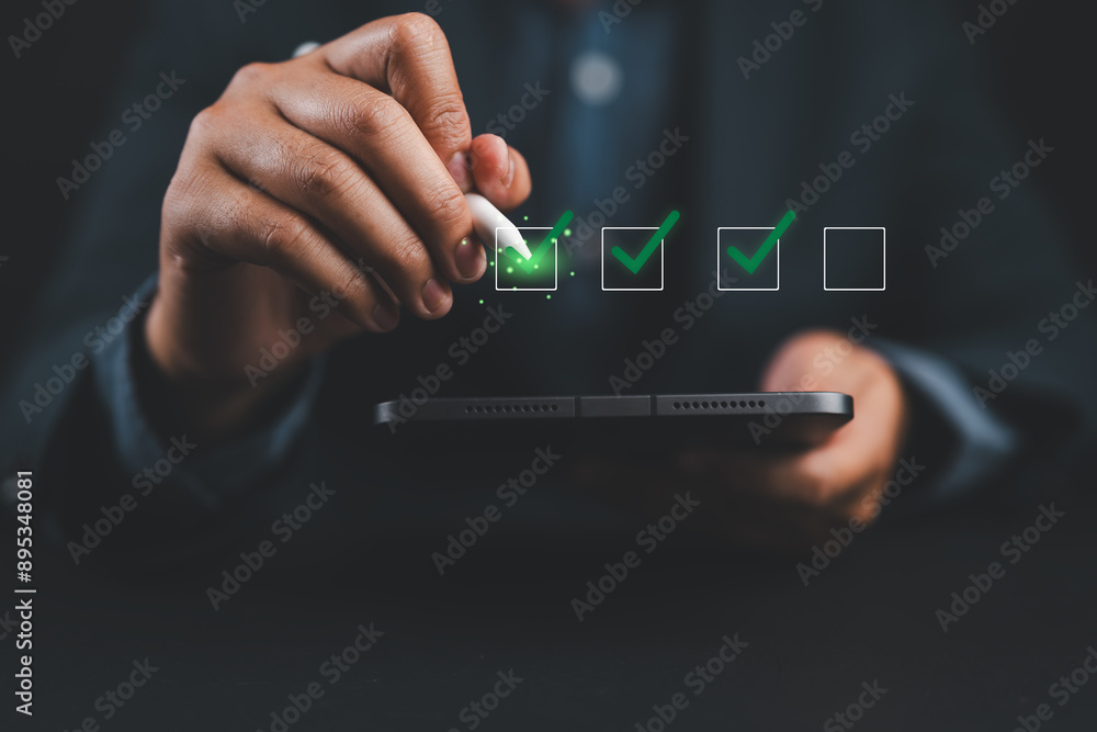 Businessman checking mark on checklist with a red checkmark. online ...