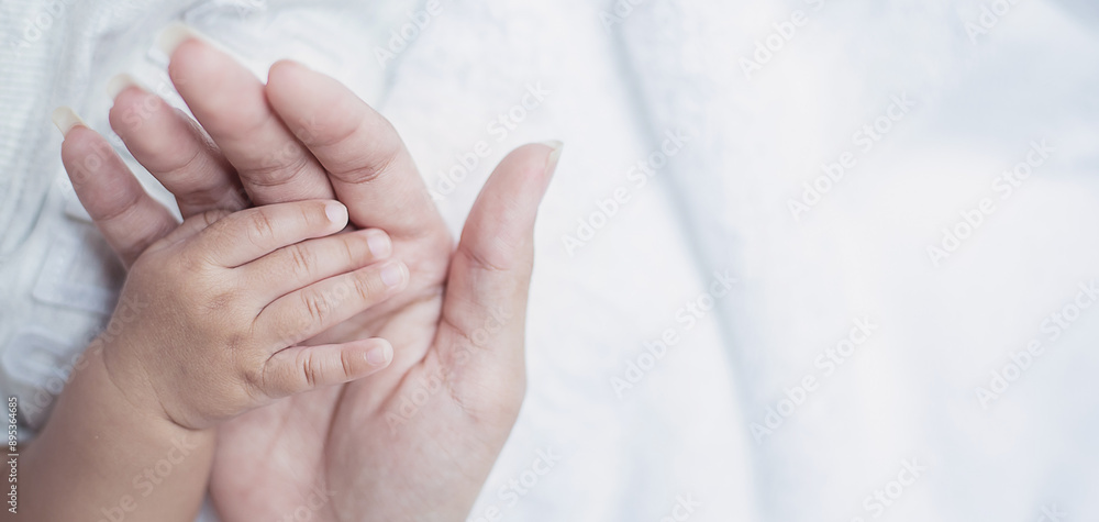 Asian parent hands holding newborn baby fingers, Close up mother's hand ...