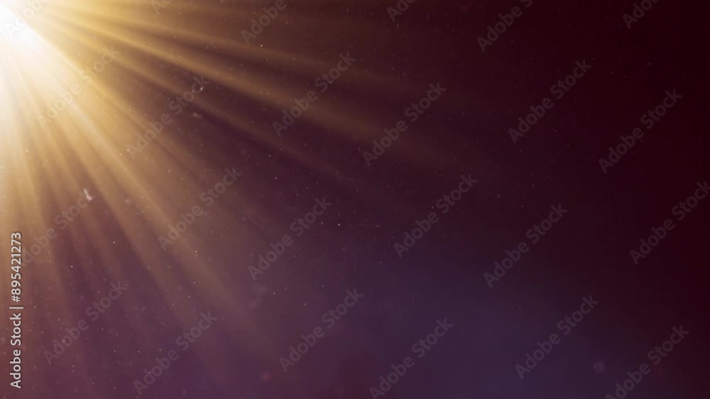 Loop of rays glow orange gold optical flare shine light from the top ...
