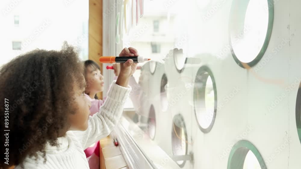 Closeup of african creative student draw beautiful picture at glass ...