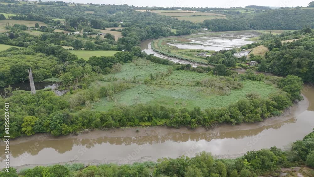 The river Tamar flowing through Cornwall and Devon featuring an old ...