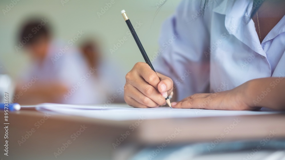 Assessment examination of high school students dressed in uniform.The ...