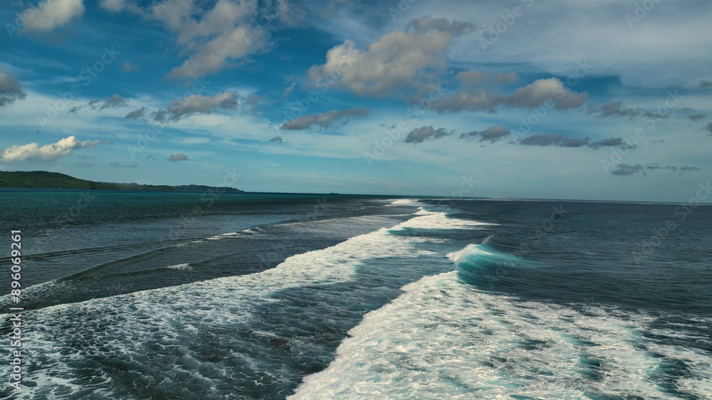 Aerial view of tropical paradise island with azure ocean waves and reef ...