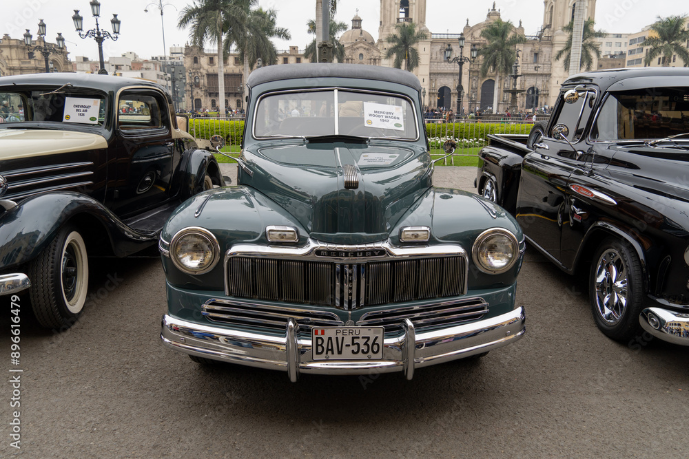 old collector cars on display in the Plaza de Armas of Lima, July 7 ...