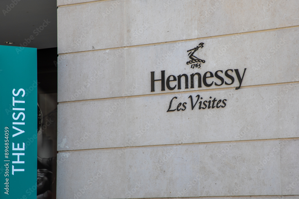 Hennessy les visites visits logo sign and text brand cognac in entrance ...