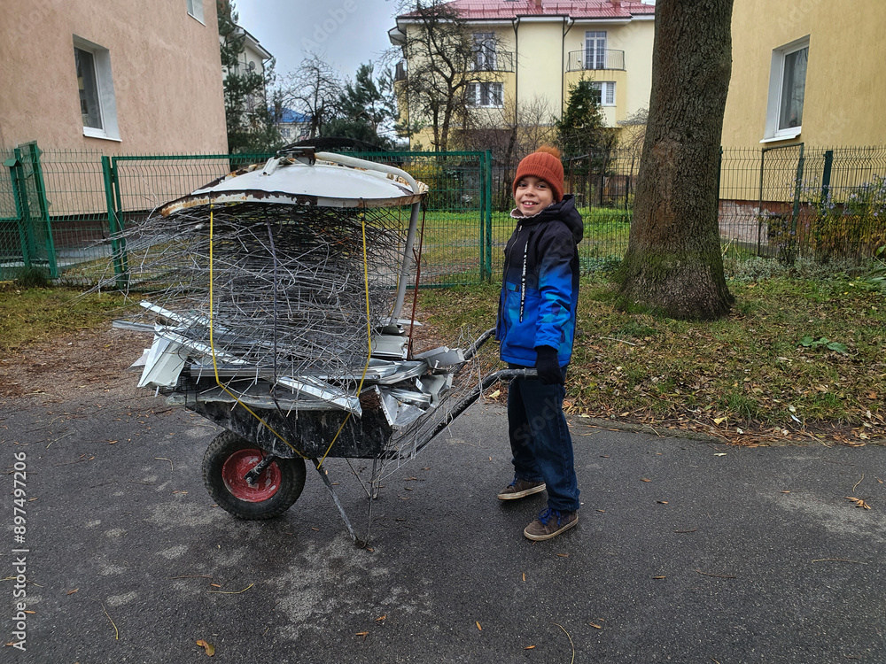 boy in a hat carrying metal for change, dysfunctional family, poverty ...
