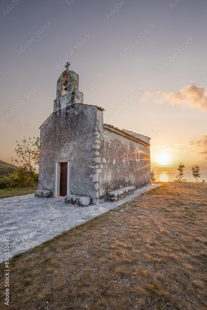 Small historic church with a path leading to it. The church stands on a ...