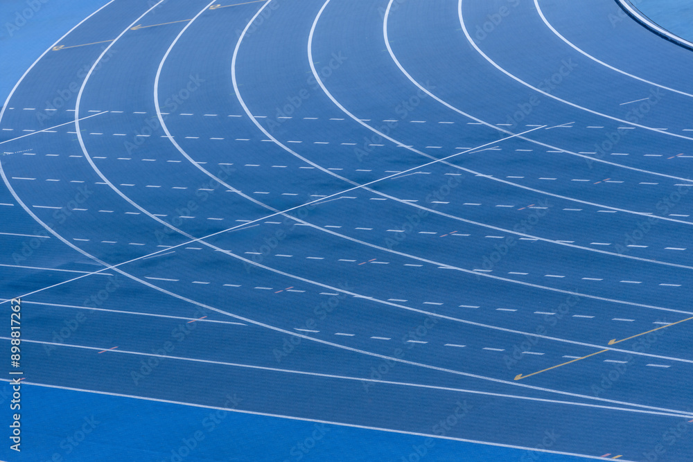 Blue track and field lanes. Running lanes at a track and field athletic ...