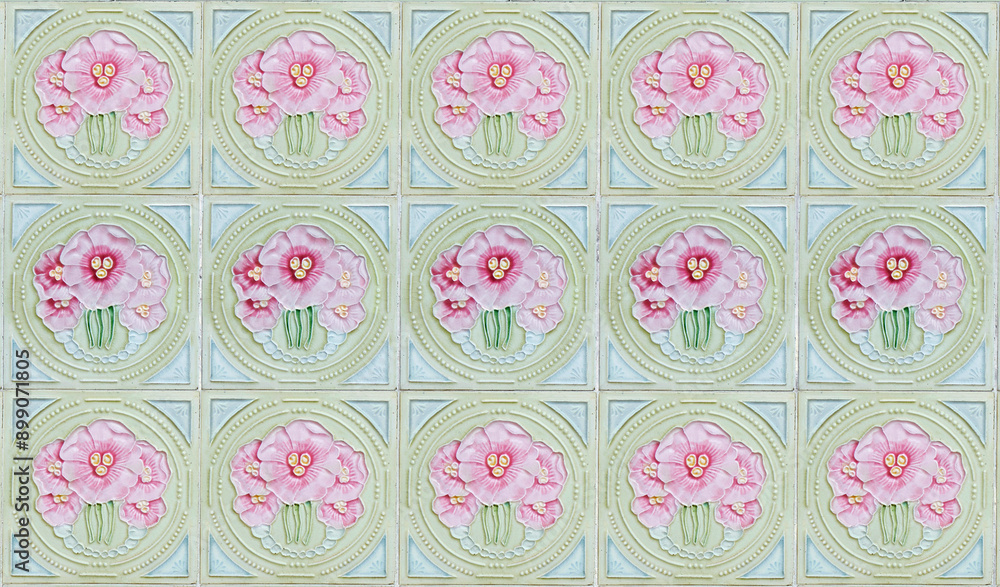 Rows of antique Nyonya Tiles with pink flowers with green background ...